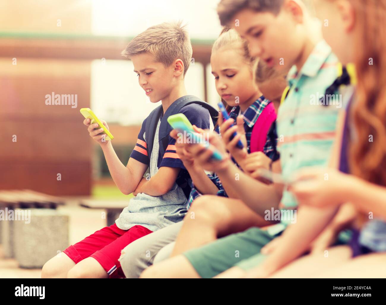 elementary school students with smartphones Stock Photo - Alamy