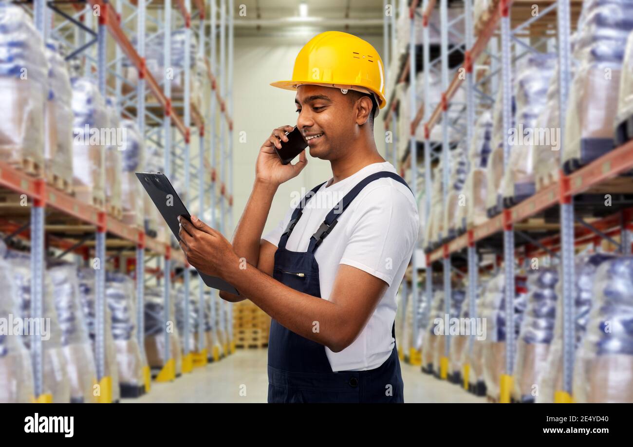 indian worker calling on smartphone at warehouse Stock Photo - Alamy