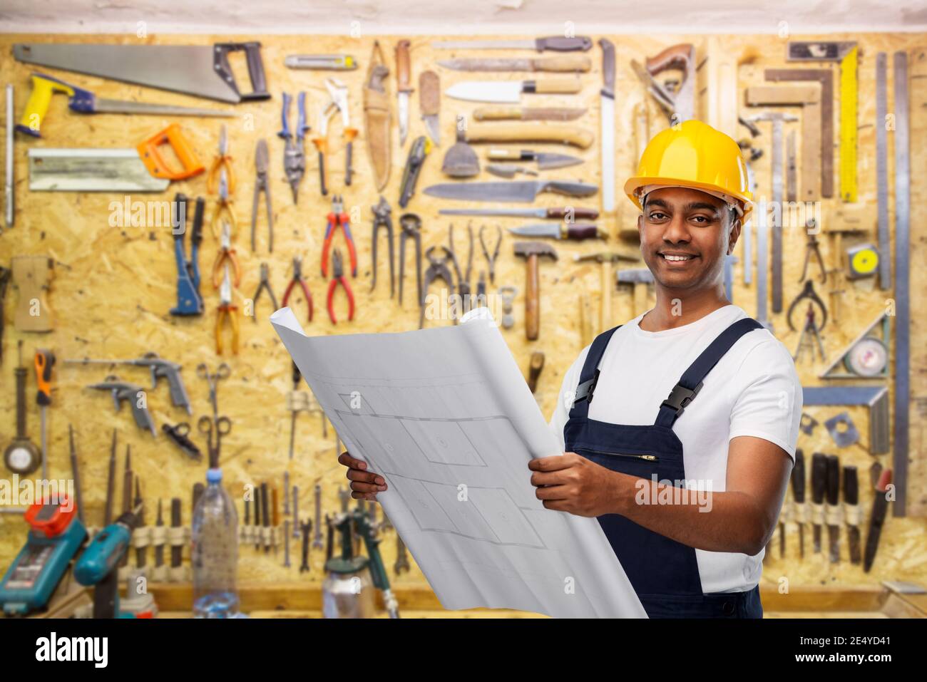 happy indian builder in helmet with blueprint Stock Photo - Alamy