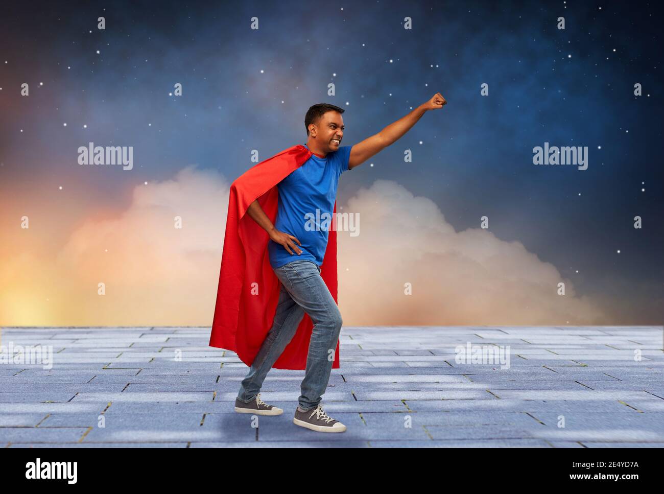 indian man in superhero cape makes winning gesture Stock Photo - Alamy