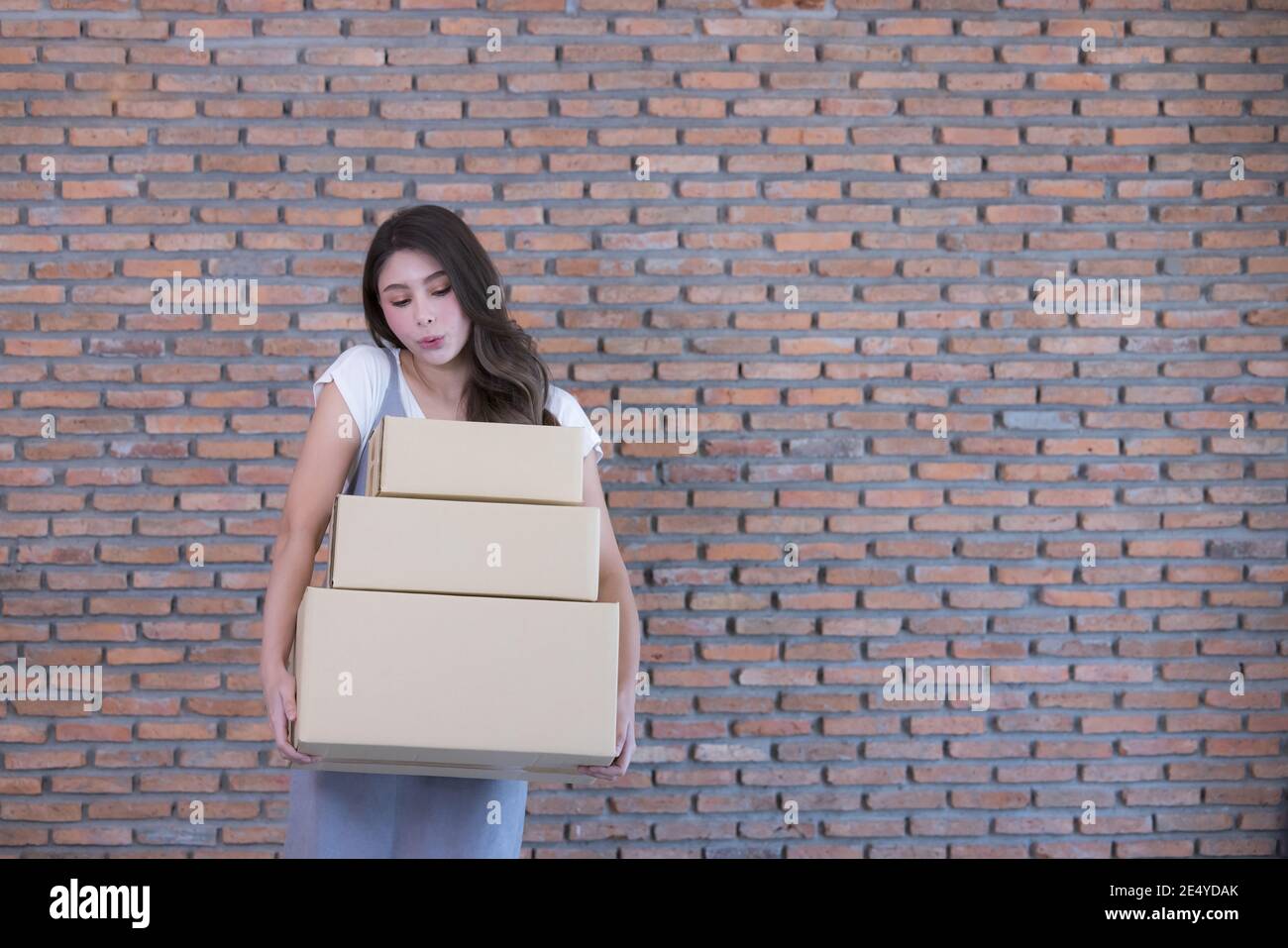 Asian woman packing boxes of parcels in her shopping online business at ...