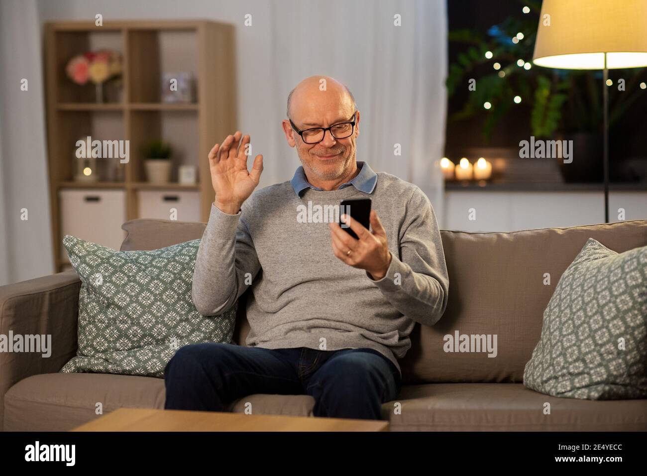 old man with smartphone having video call at home Stock Photo - Alamy