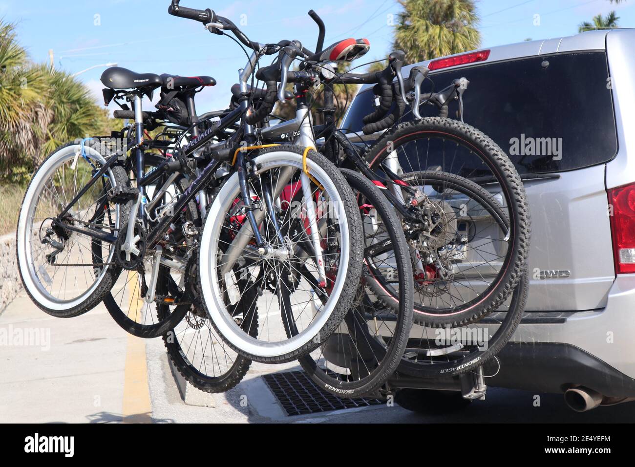 Bicycles attached to the back of a vehicle Stock Photo - Alamy