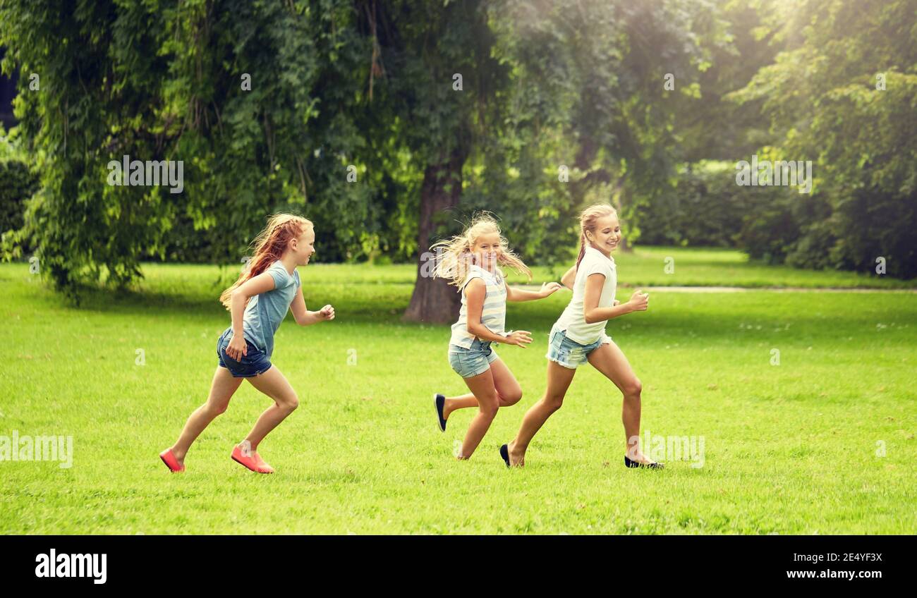 happy kids running and playing game outdoors Stock Photo - Alamy