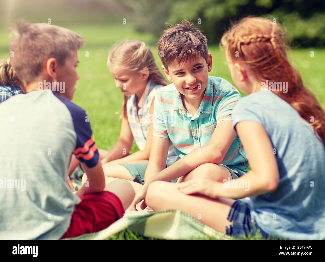 group of happy kids or friends outdoors Stock Photo - Alamy