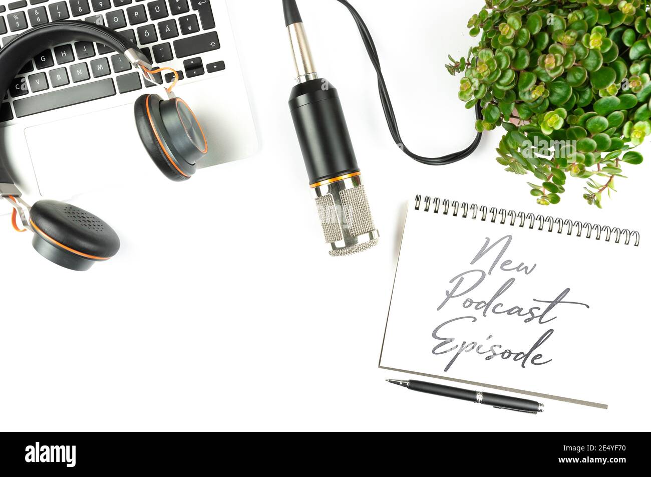 above view of laptop computer, microphone and notepad with text NEW ...