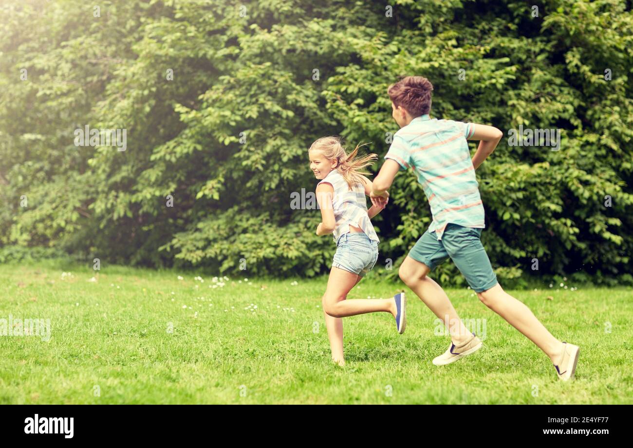 happy kids running and playing game outdoors Stock Photo - Alamy