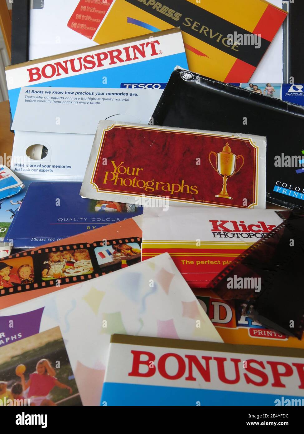 Array of photo wallets eg Bonusprint, Boots, Tesco, Kodak & Klick, who ...