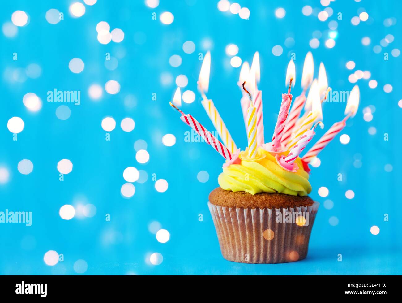 birthday cupcake with many burning candles Stock Photo - Alamy