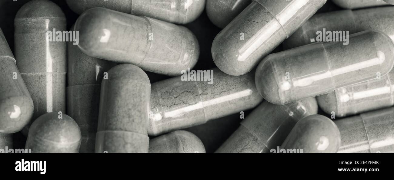 Green and grey capsules hi-res stock photography and images - Alamy