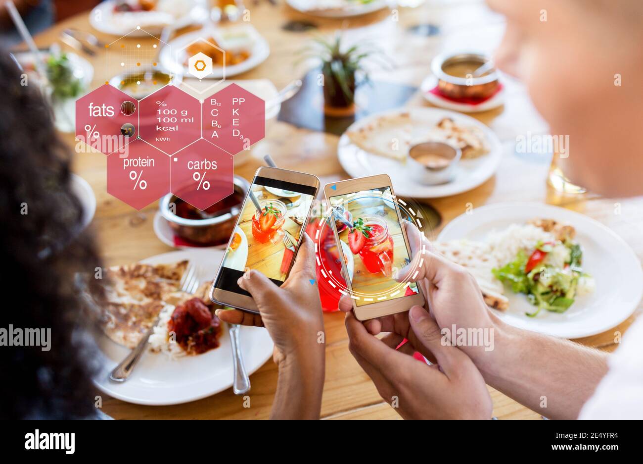 hands with phone and food nutritional value chart Stock Photo - Alamy