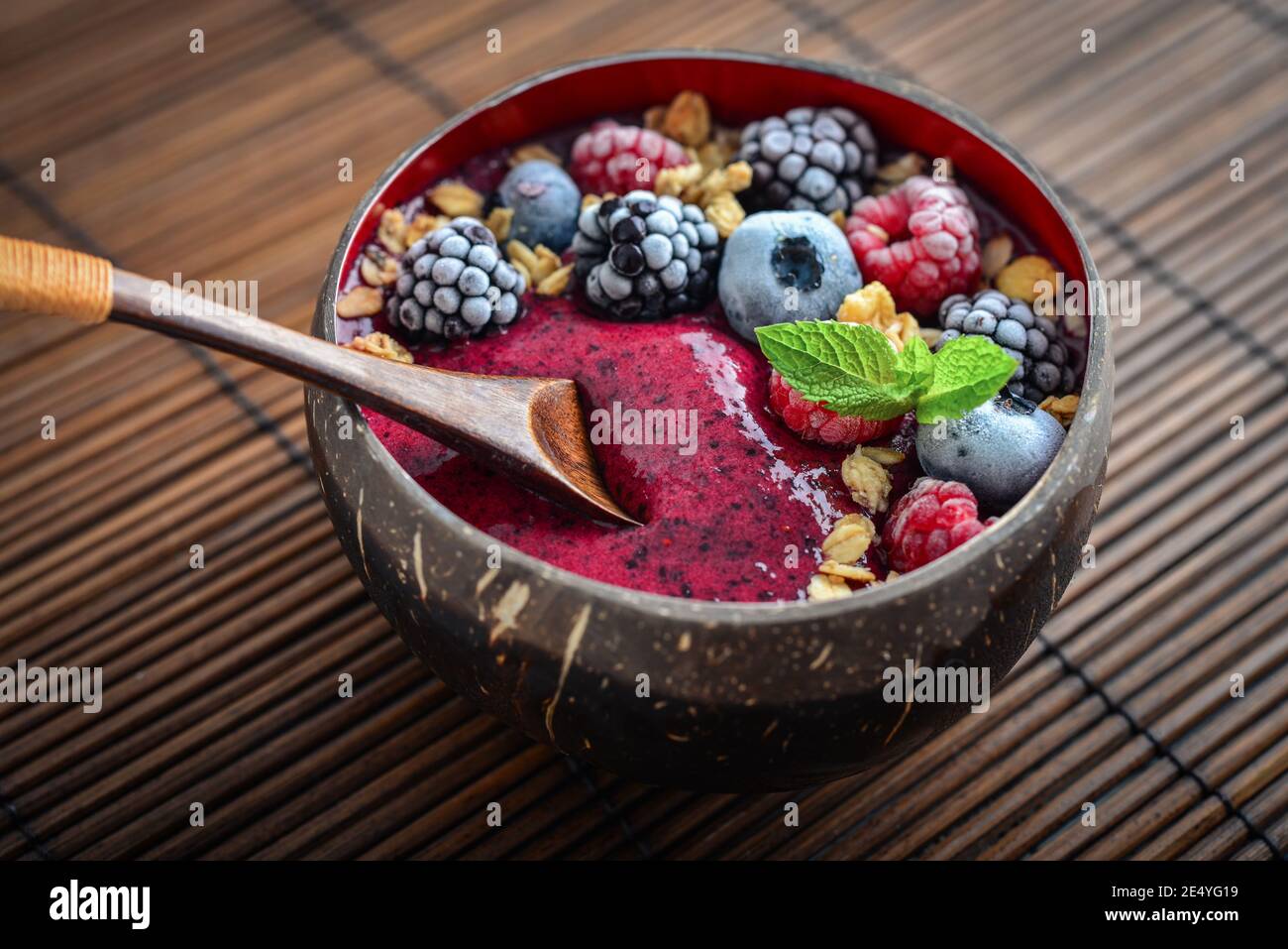 Acai smoothie bowl with blueberry, blackberry, raspberry, granola and ...