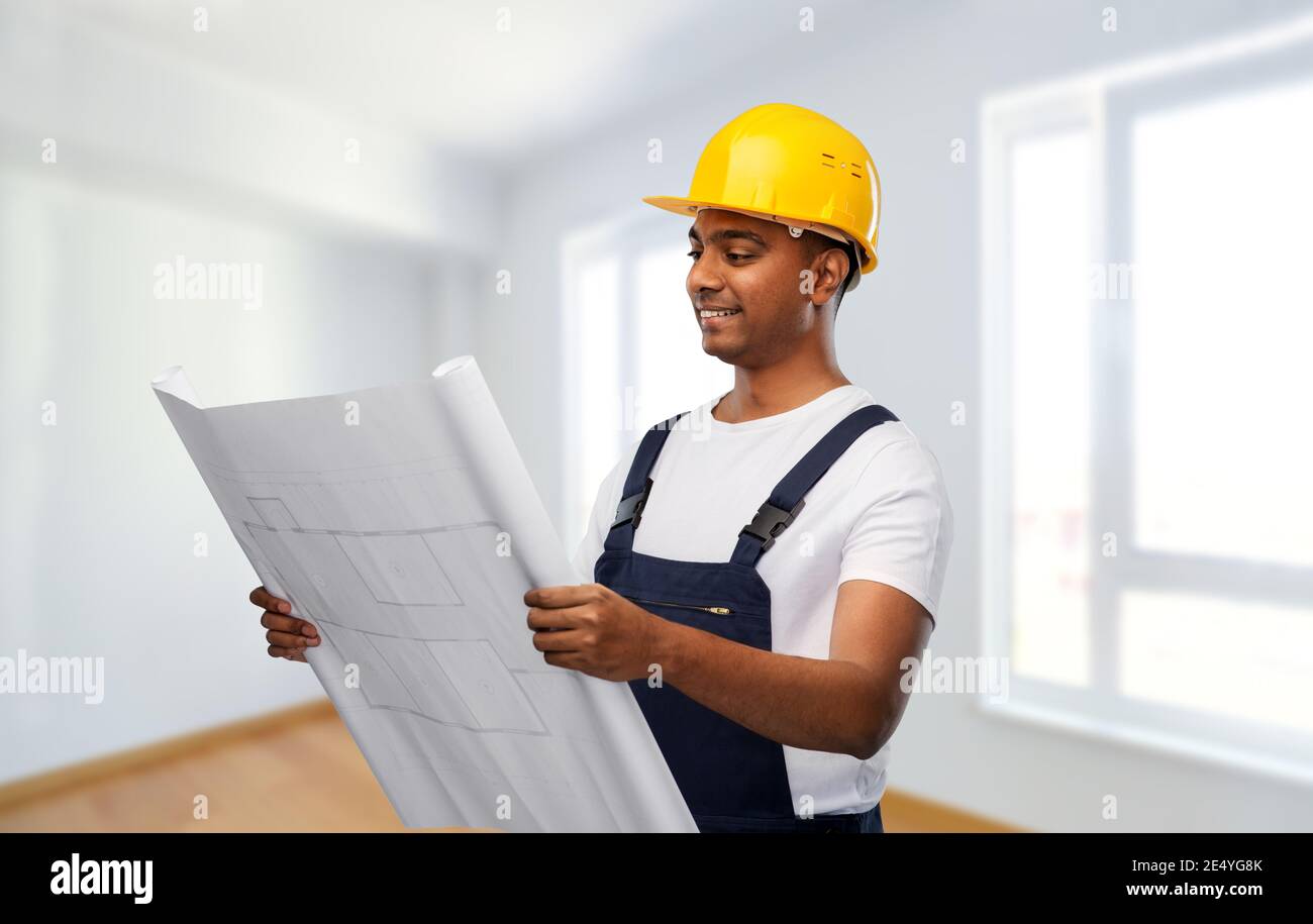 happy indian builder in helmet with blueprint Stock Photo - Alamy