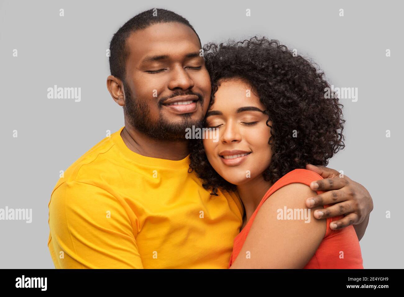 happy african american couple hugging Stock Photo - Alamy