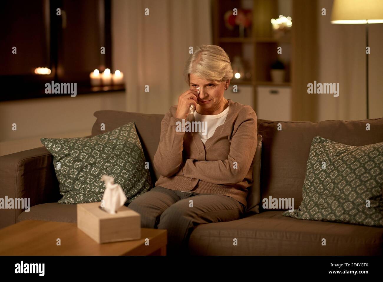 crying senior woman wiping tears with paper tissue Stock Photo - Alamy