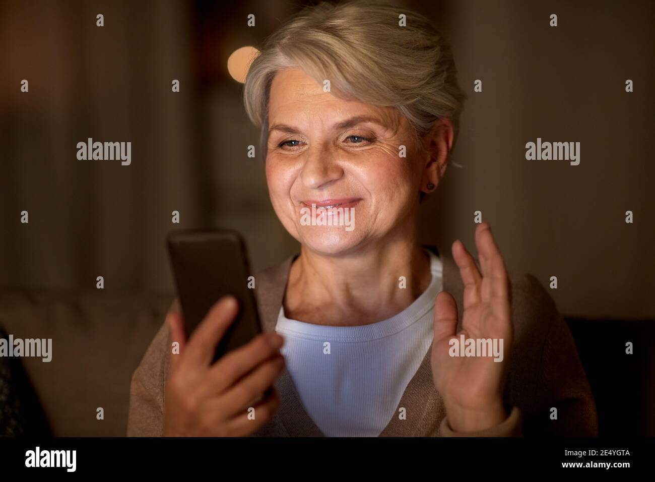 happy old woman with smartphone having video call Stock Photo - Alamy