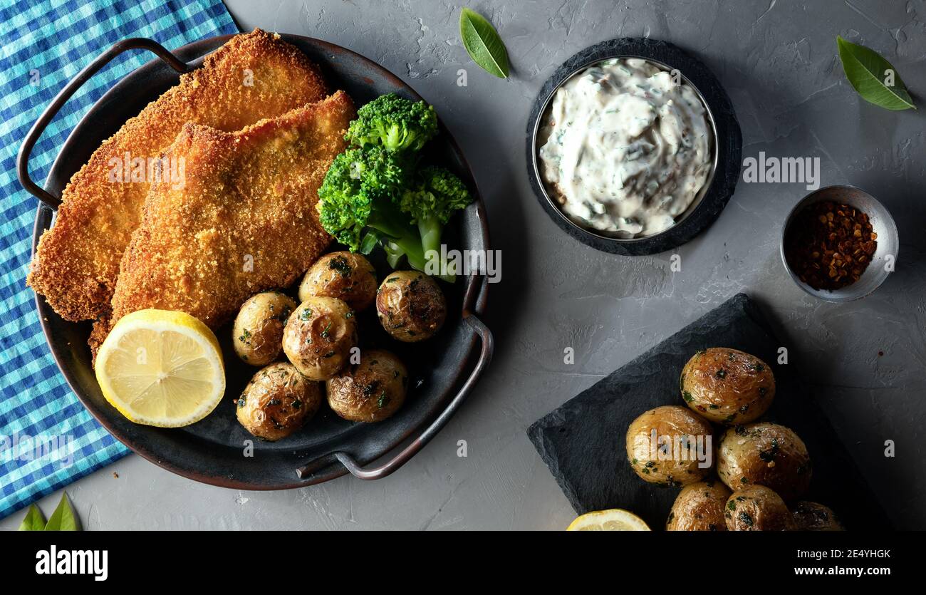 Schnitzel - traditional Austrian (German) breaded meat with potatoes ...