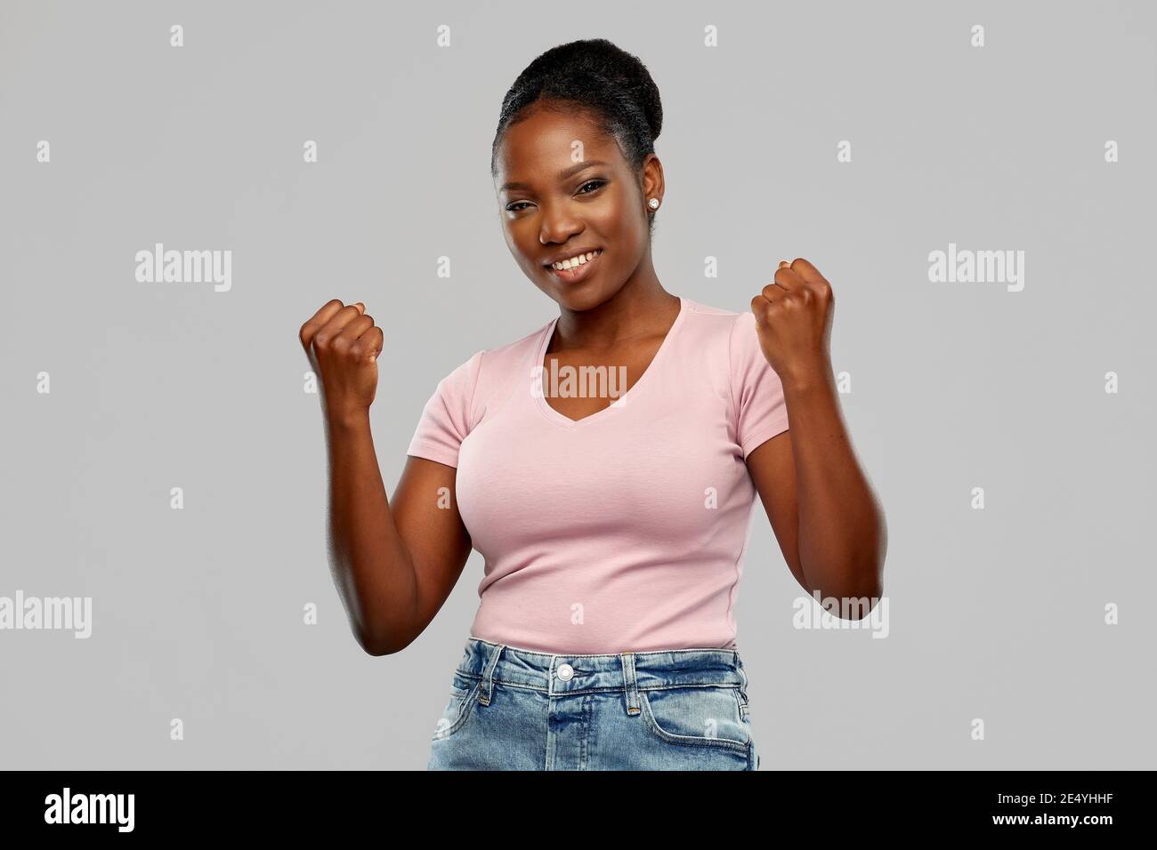 African american woman looking celebrating hi-res stock photography and ...