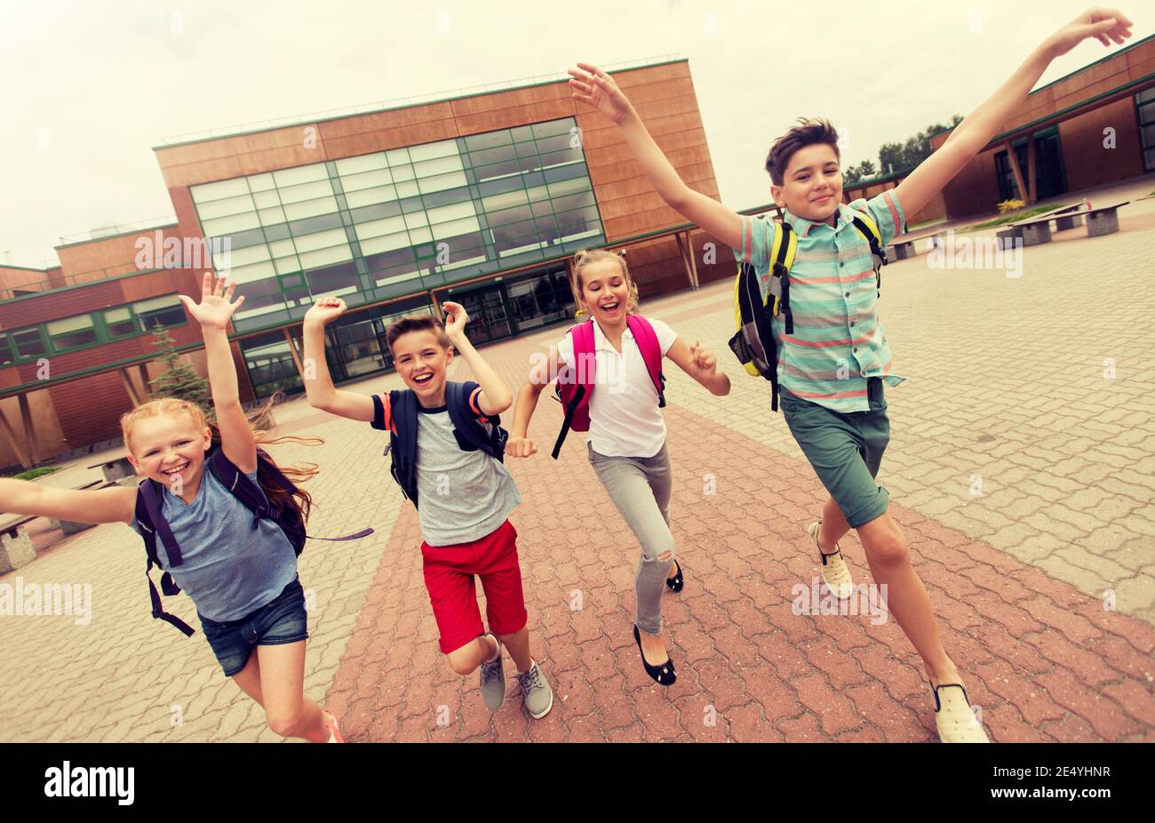 group of happy elementary school students running Stock Photo - Alamy