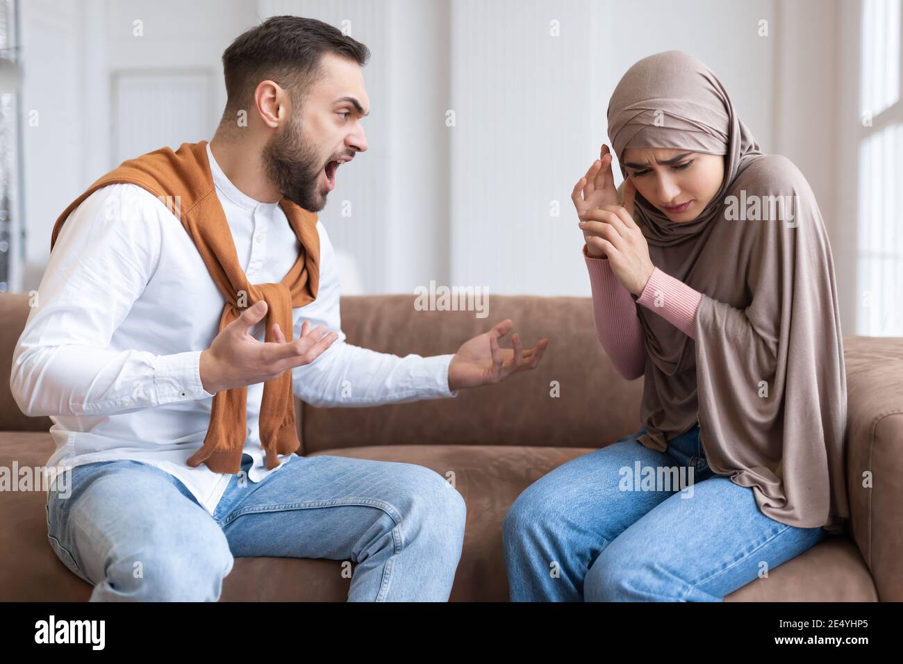 Aggressive Muslim Husband Shouting At Scared Wife Sitting At Home Stock ...