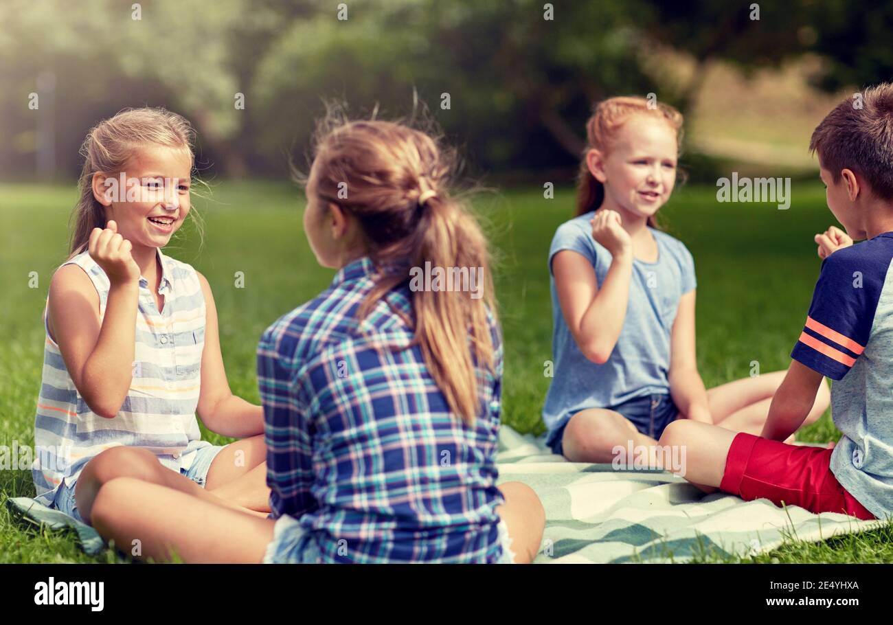 happy kids playing rock-paper-scissors game Stock Photo - Alamy
