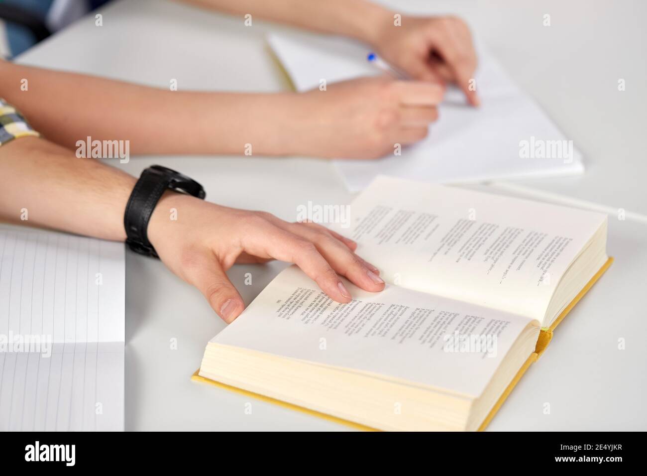 hands of students with books and notebooks Stock Photo - Alamy