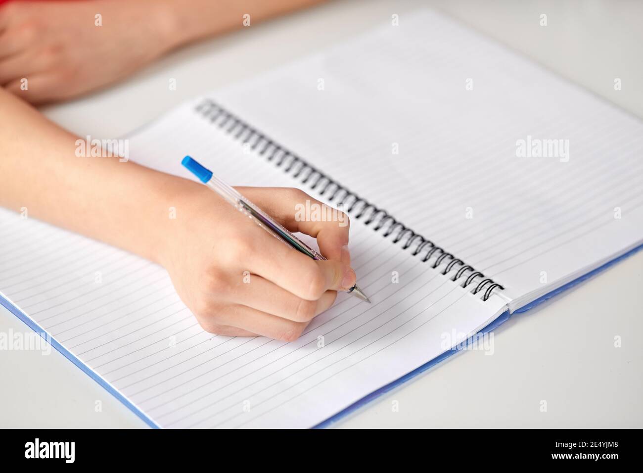 Hands writing exam paper hi-res stock photography and images - Alamy