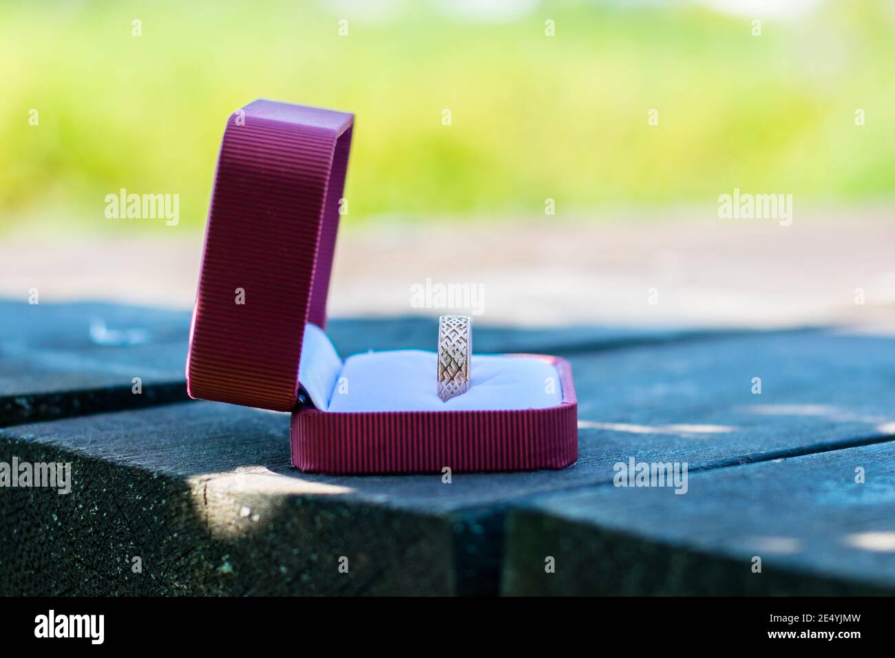 Two wedding rings in a red velvet box during a wedding Stock Photo - Alamy