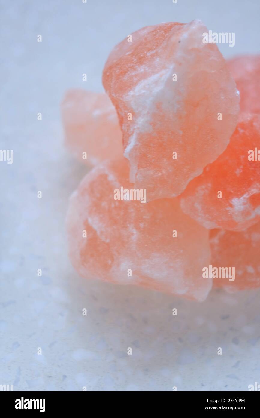Pink Himalayan salt close-up on an orange background Stock Photo - Alamy