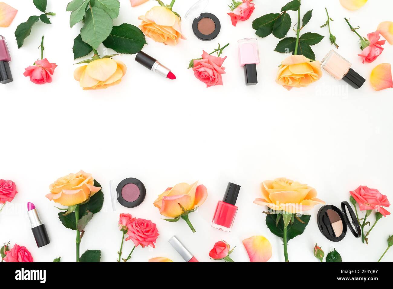 Flower frame with rose flowers, petals and make up cosmetics on white ...