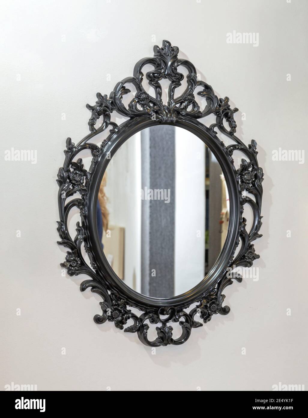 Rustic Style Black Mirror Frame at Wall Stock Photo - Alamy