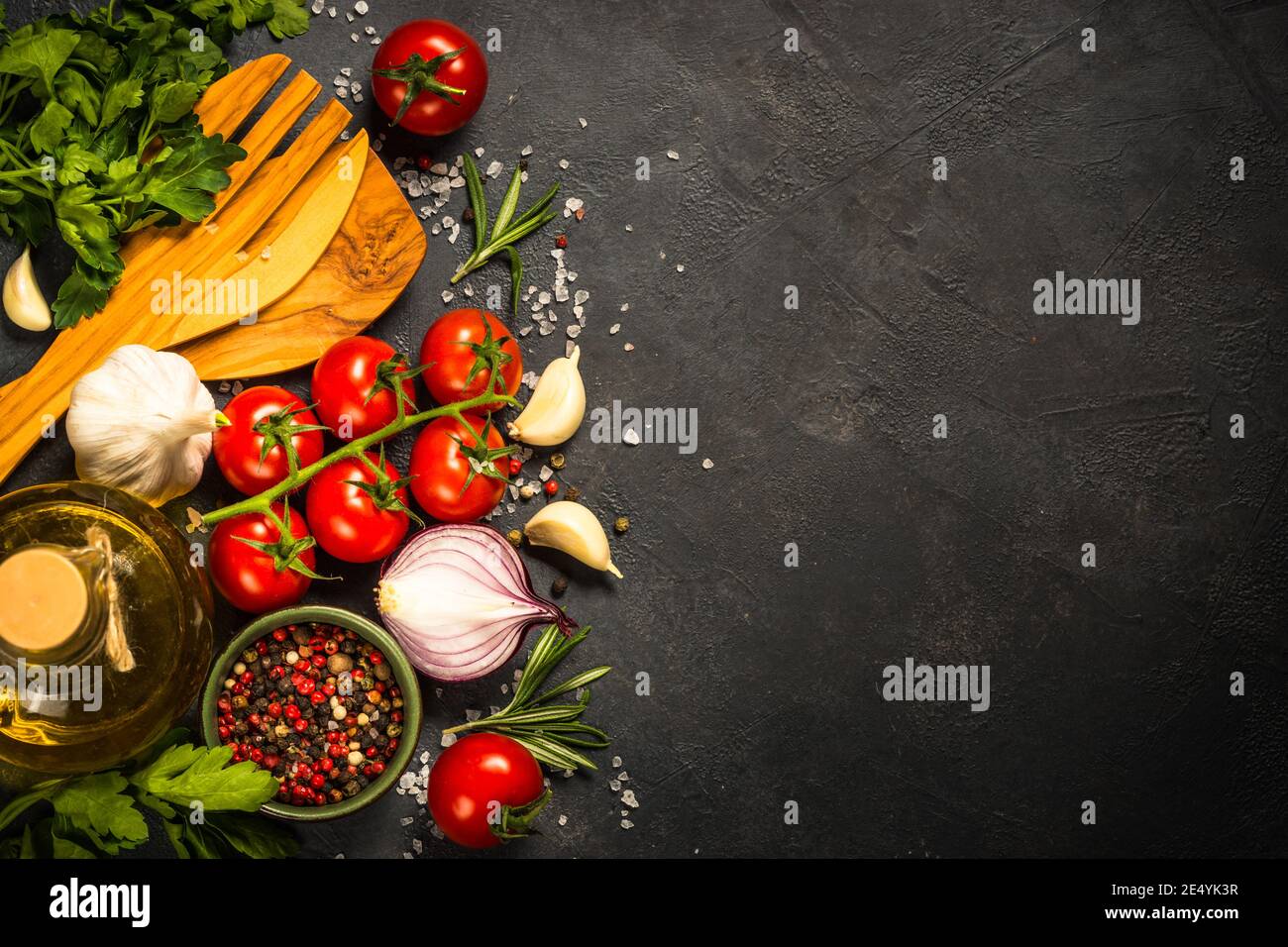 Food cooking background on black table Stock Photo - Alamy