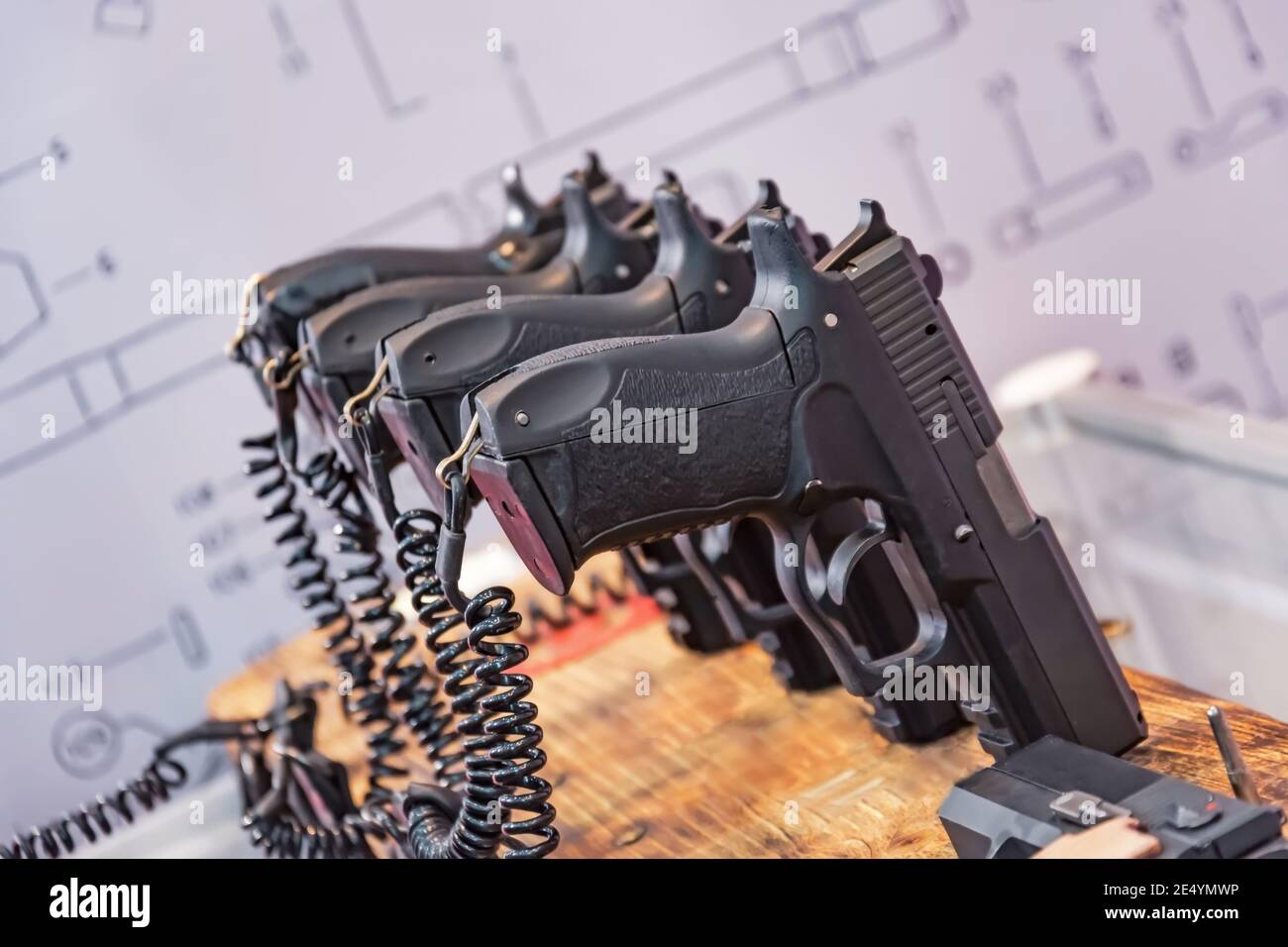 Series of black handguns for target shooting Stock Photo - Alamy