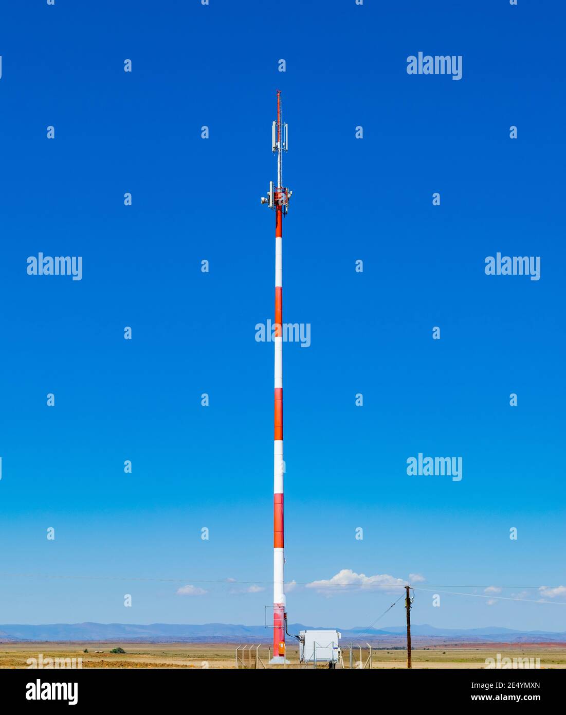 Vertical shot of a telecommunication tower under the clear blue sky Stock Photo - Alamy
