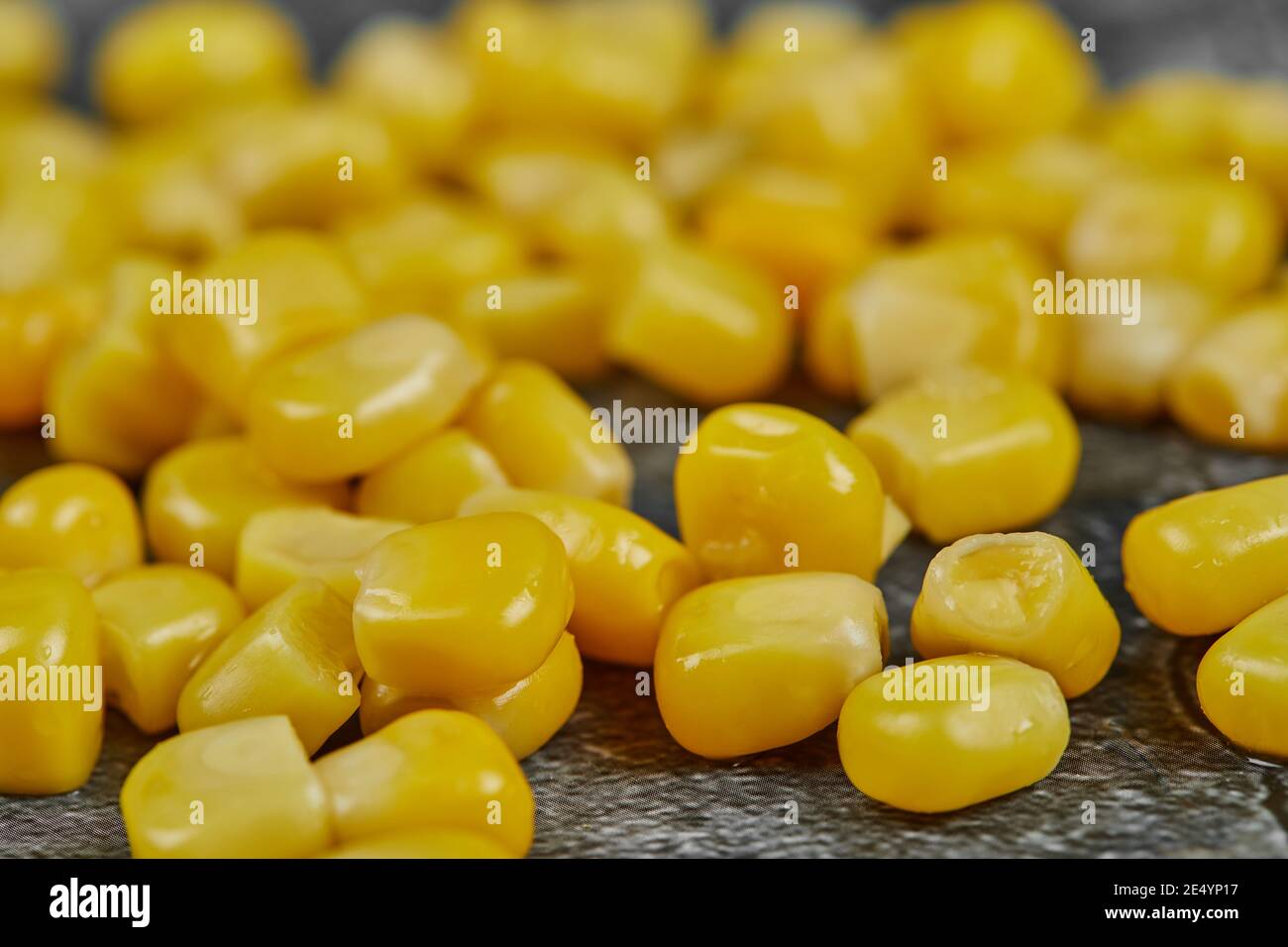 A heap of boiled sweet corn on a marble background Stock Photo - Alamy