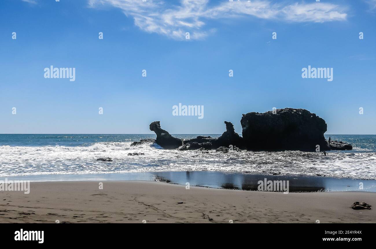 Rocks on El Tunco Beach at sunset. El Tunco, El Salvador Stock Photo ...