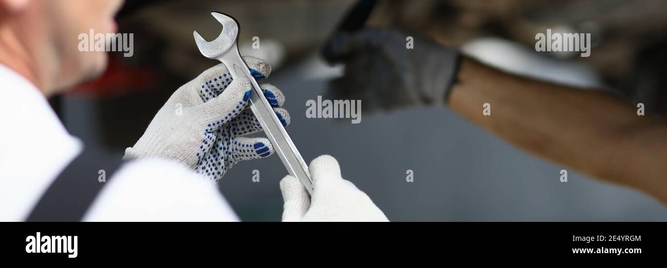 Man holding spanner hi-res stock photography and images - Alamy