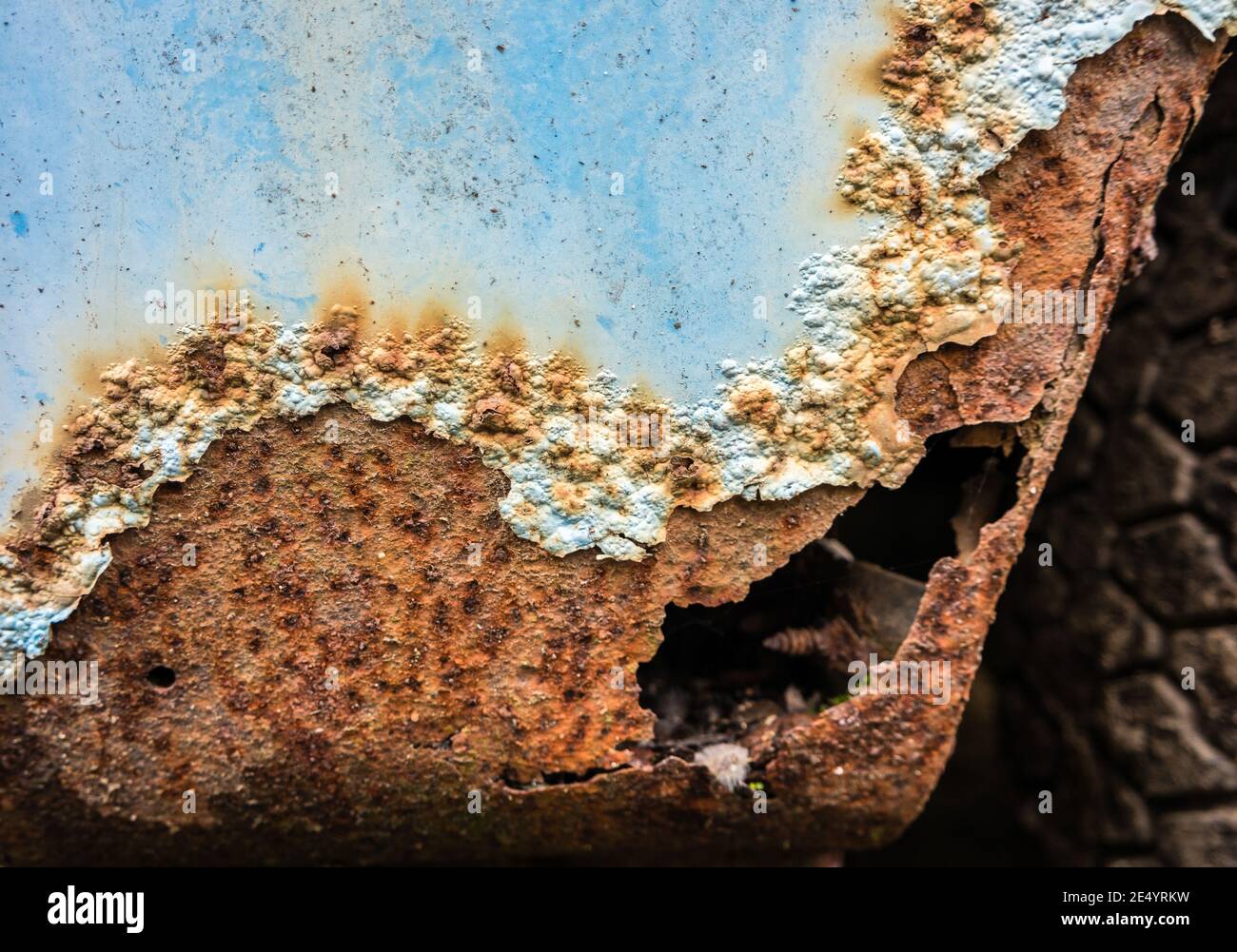 Rust on a blue car over the wheel Stock Photo - Alamy