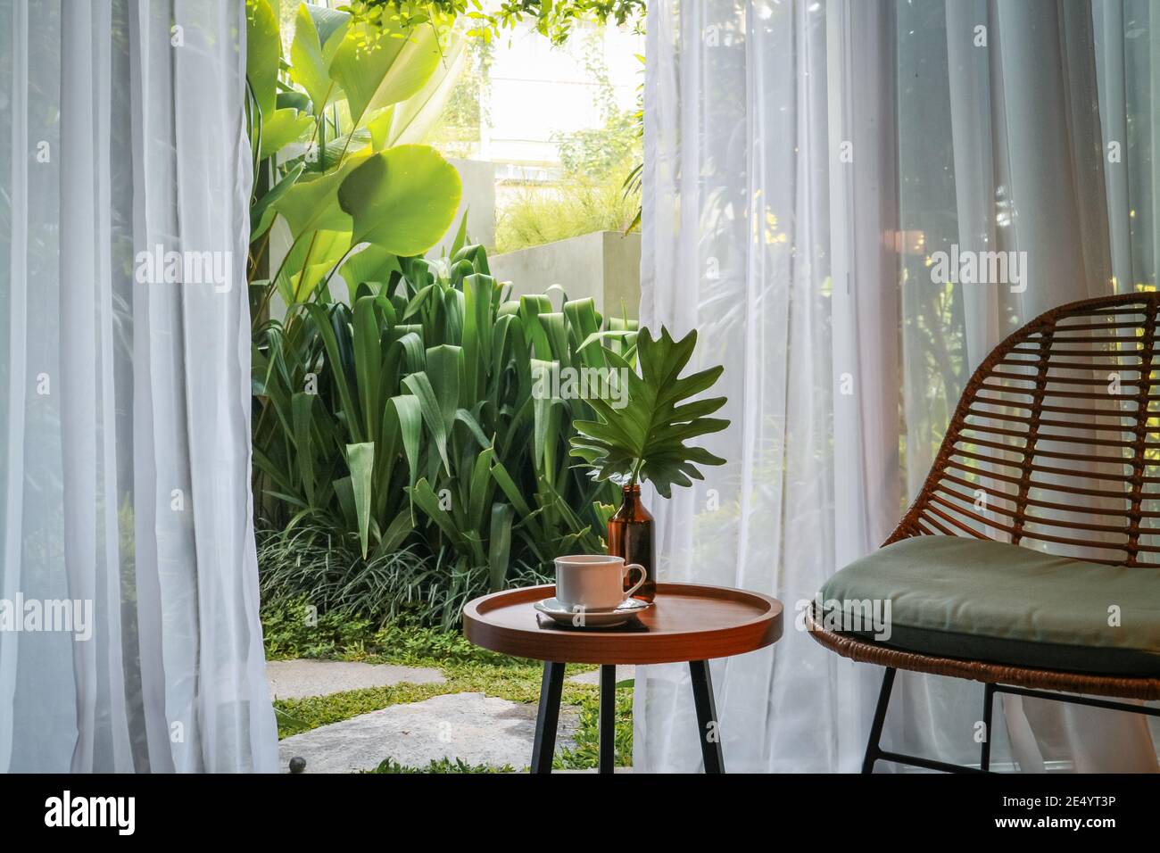 Beautiful tropical terrace or balcony with small table, chair and ...