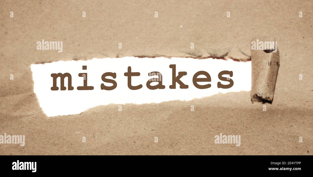 Torn paper with text MISTAKES, business concept Stock Photo - Alamy