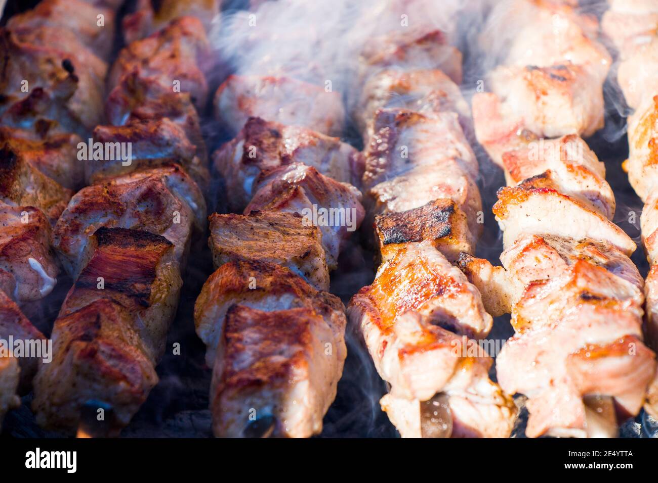 Georgian traditional dish, Mtsvadi on the fire, raw meal on the grill ...