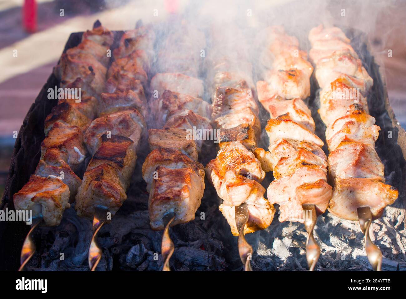 Georgian traditional dish, Mtsvadi on the fire, raw meal on the grill ...