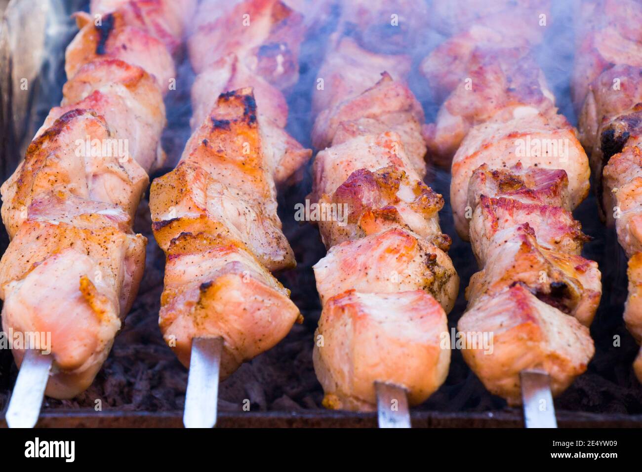 Georgian traditional dish, Mtsvadi on the fire, raw meal on the grill ...