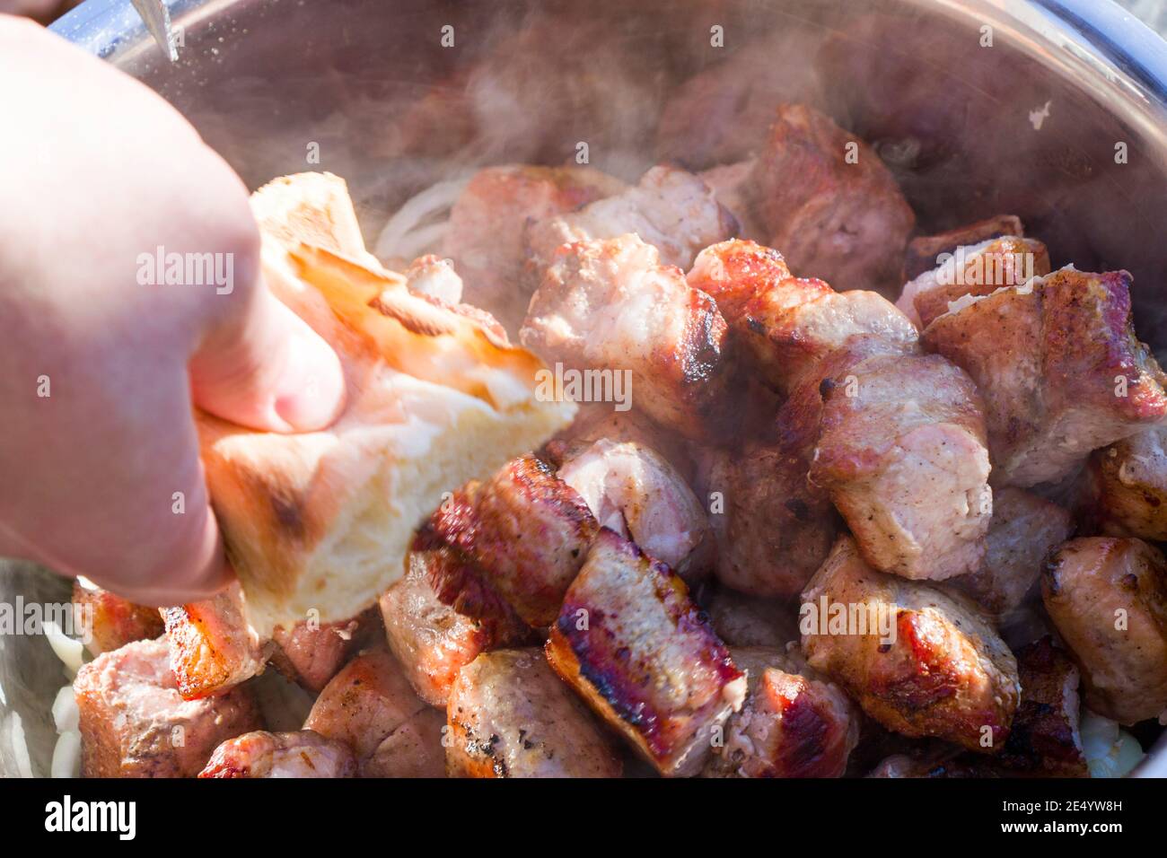 Georgian traditional dish, Mtsvadi on the fire, raw meal on the grill ...