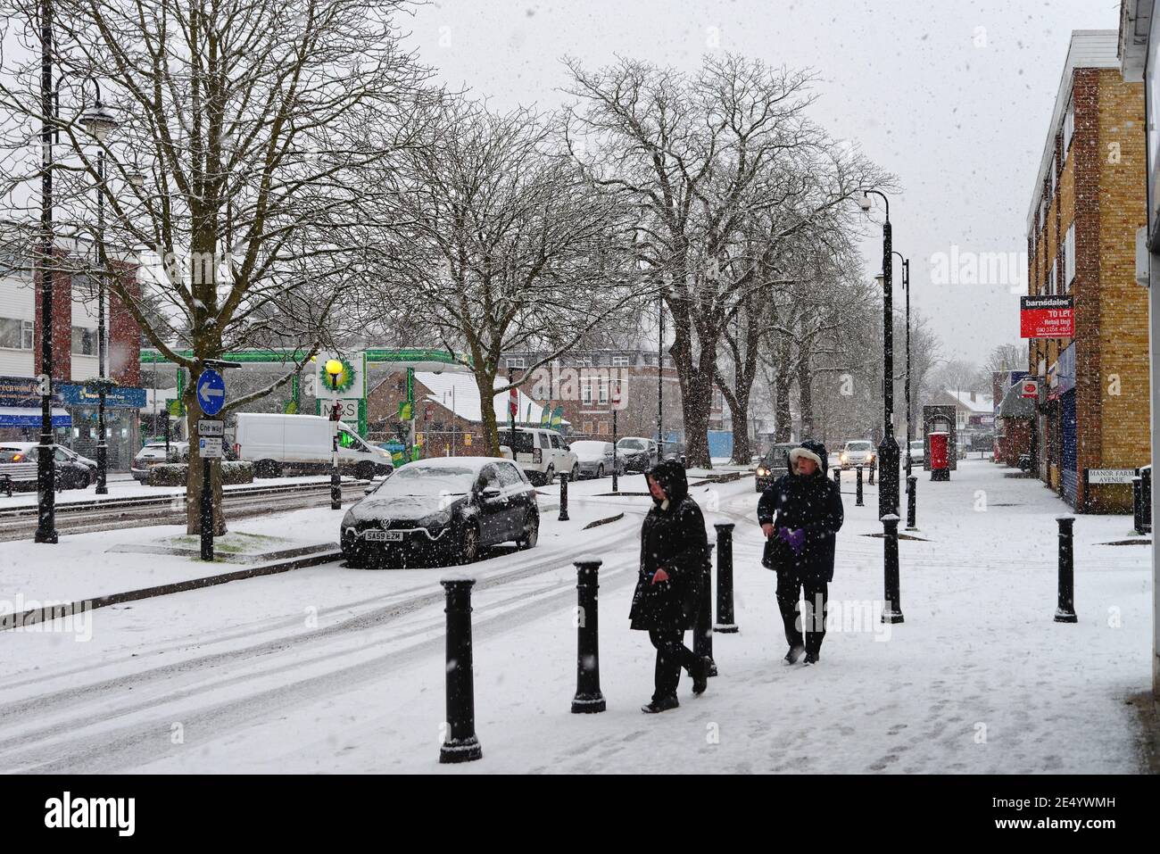 Heavy snowfall in a suburban high street, Shepperton Surrey England UK ...