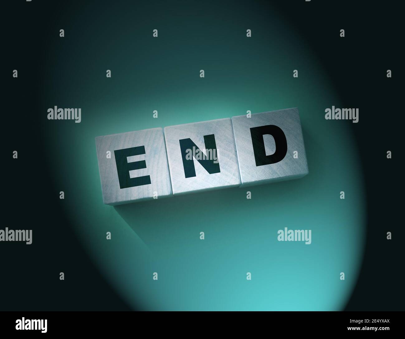 End word on wooden cubes on beige brown. Finishing business project ...