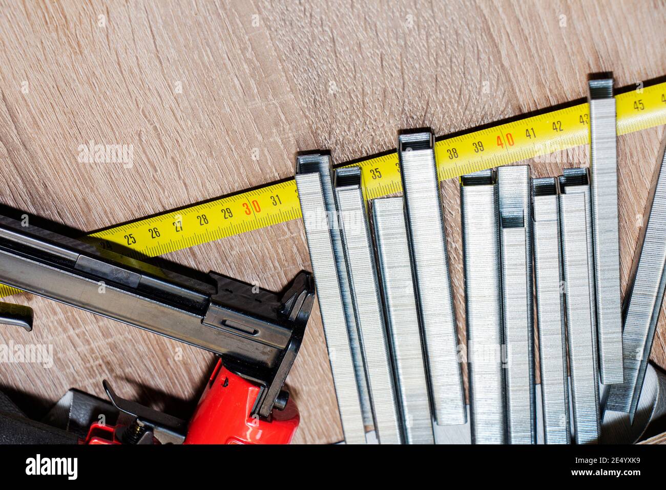 concept of furniture production and repair. Stapler and staples ...