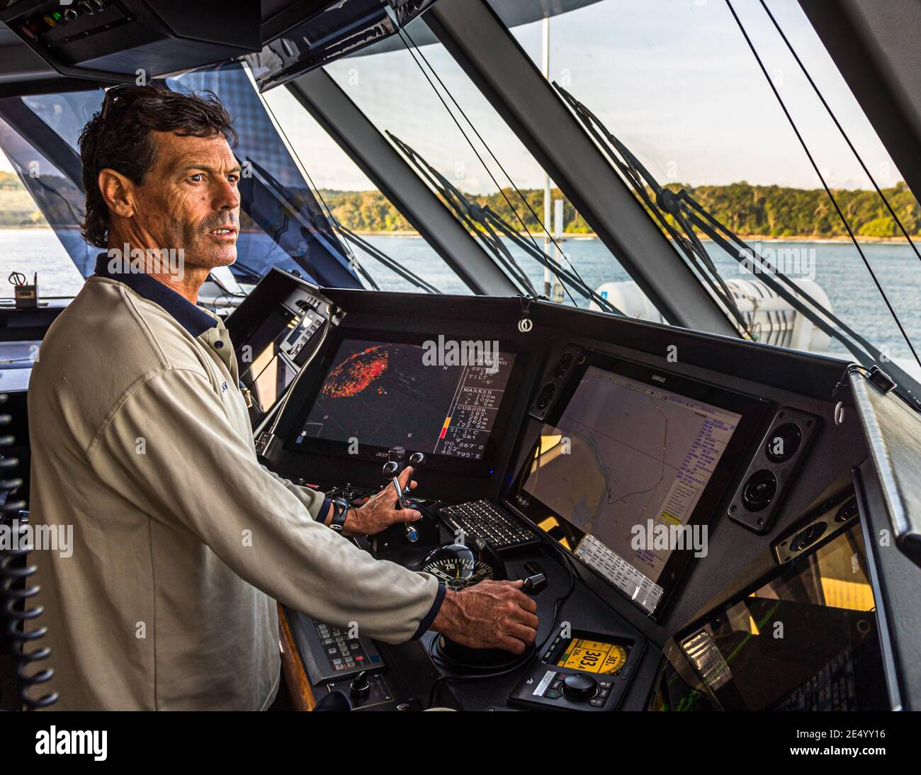 Ship captain with navigation monitors Stock Photo - Alamy