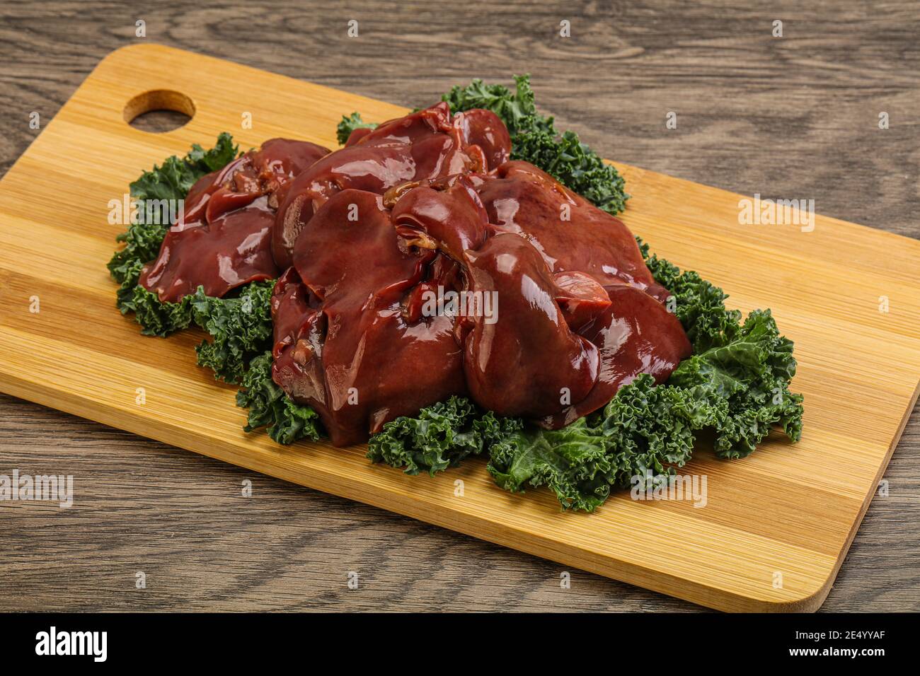 Raw chicken liver over board for cooking Stock Photo - Alamy
