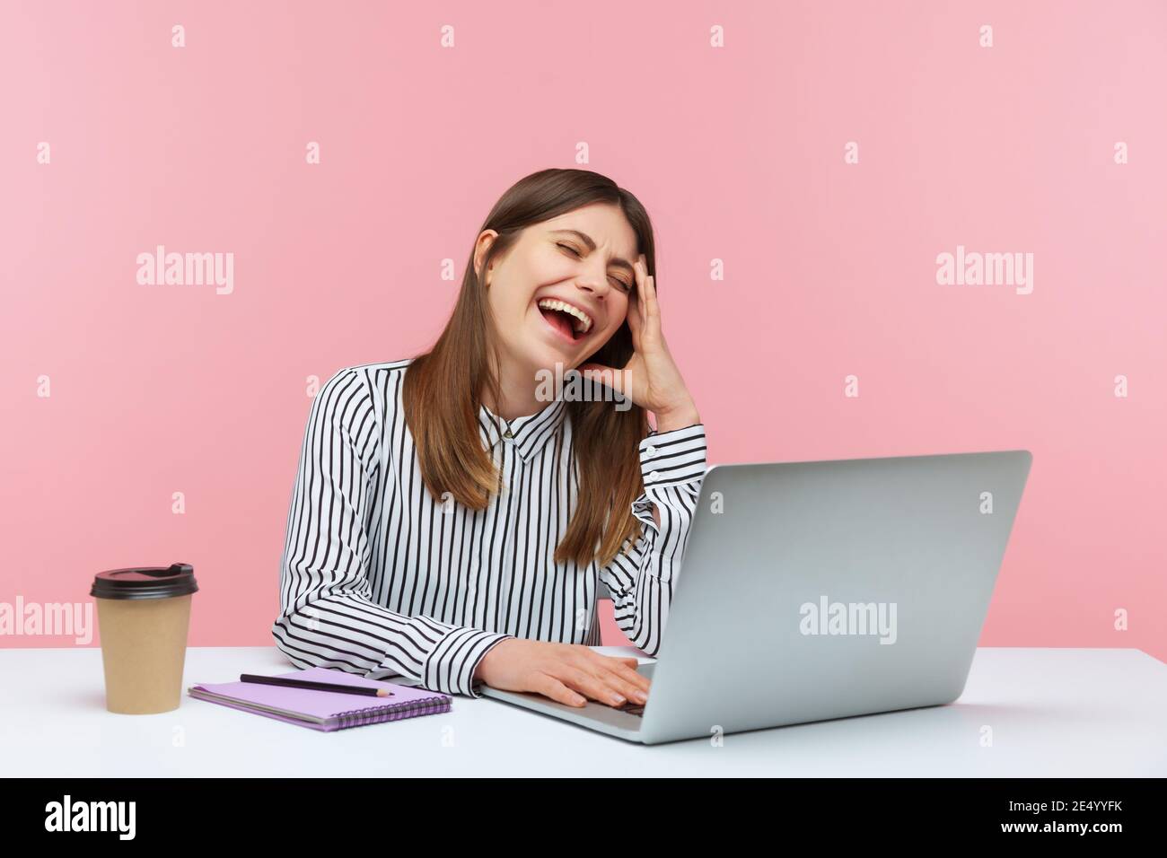 Amused happy woman office worker laughing out loud, sitting at ...
